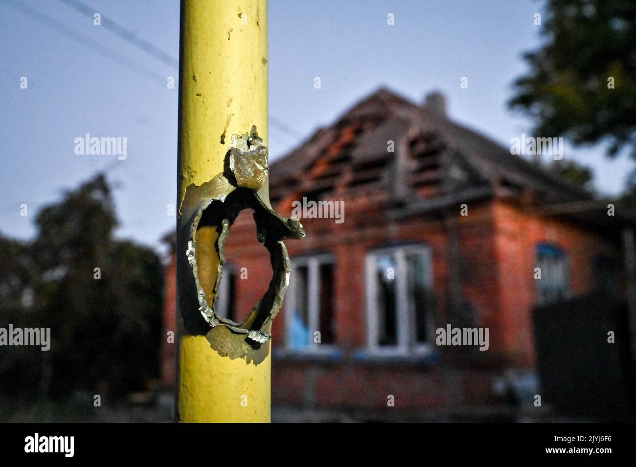 MALA TOKMACHKA, UKRAINE - SEPTEMBER 7, 2022 - A shrapnel hole is ...