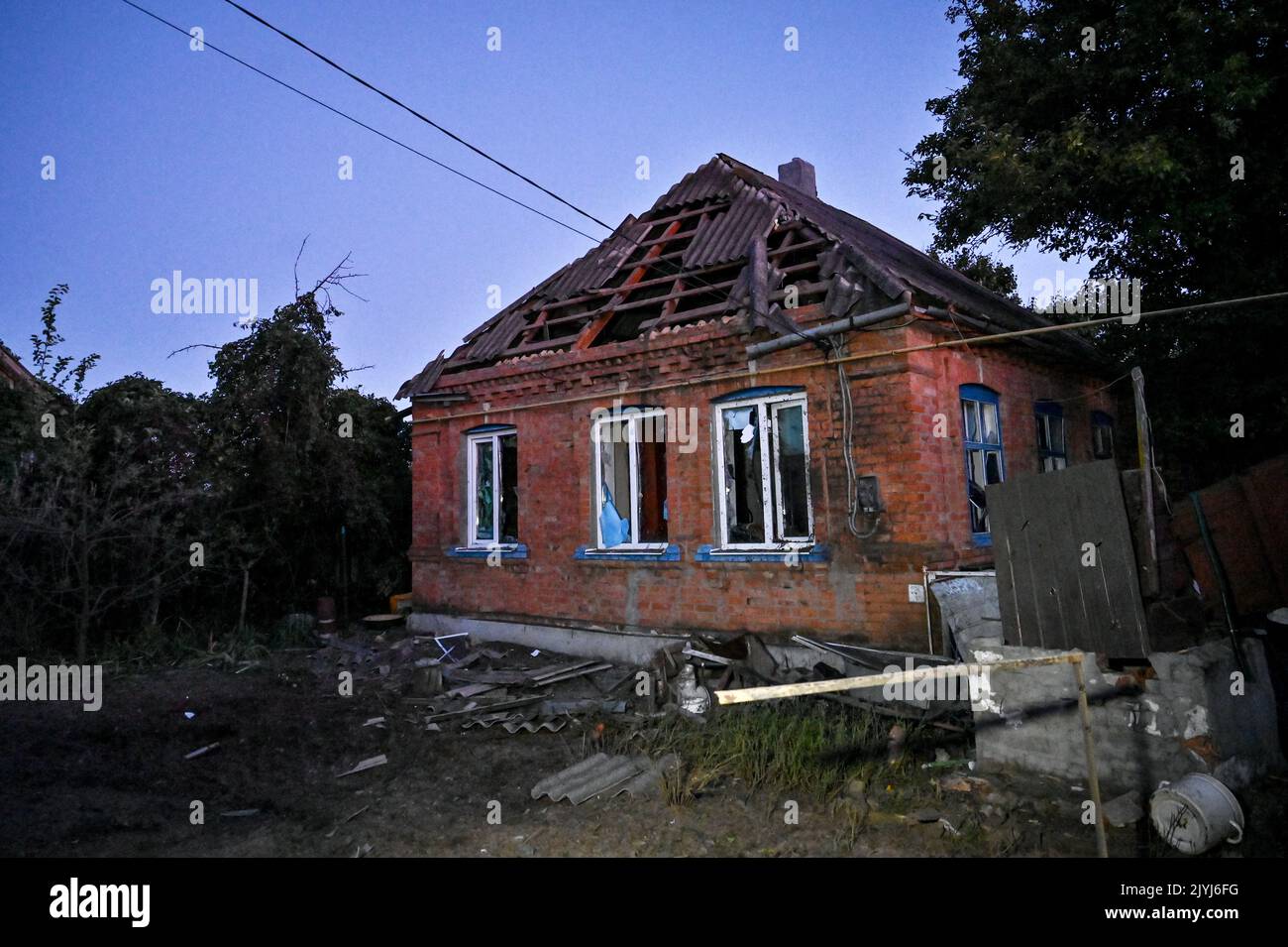 MALA TOKMACHKA, UKRAINE - SEPTEMBER 7, 2022 - Damage done to a house by ...