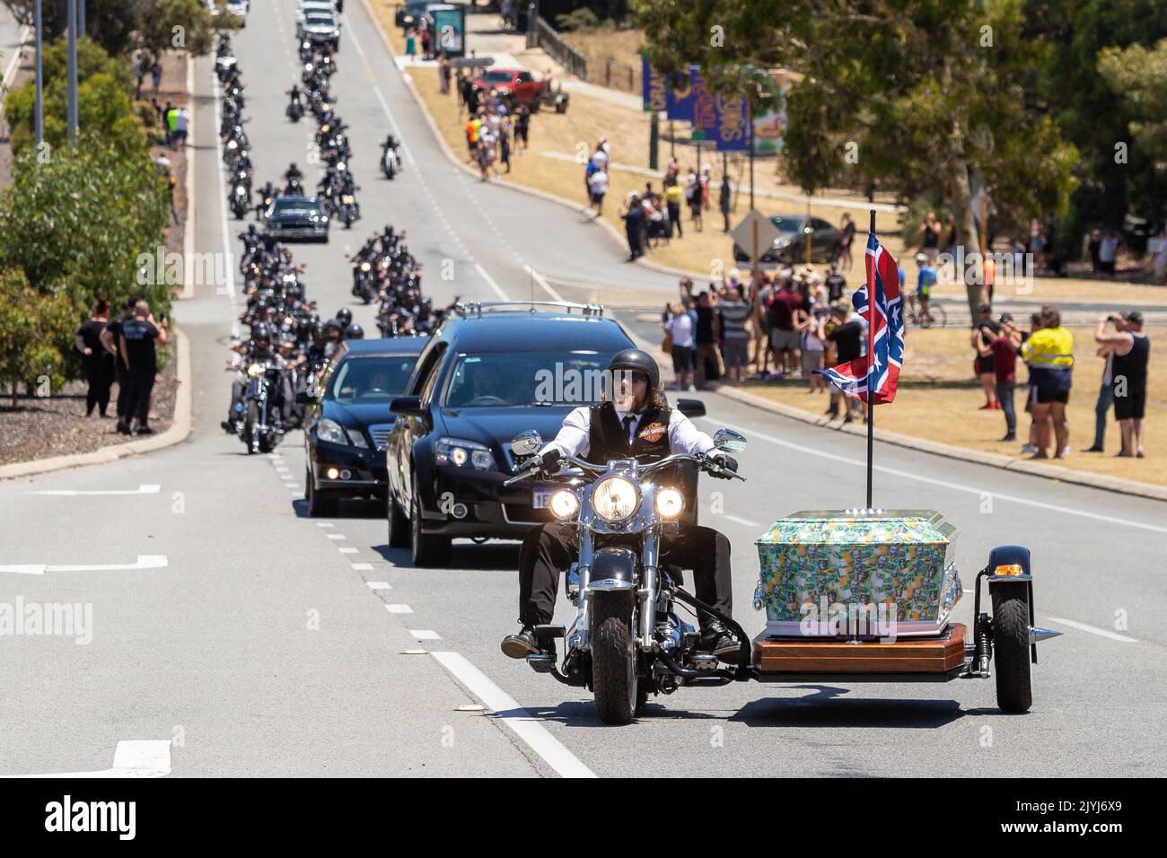 A motorcade follows the coffin of Rebels bikie Nick Martin into ...