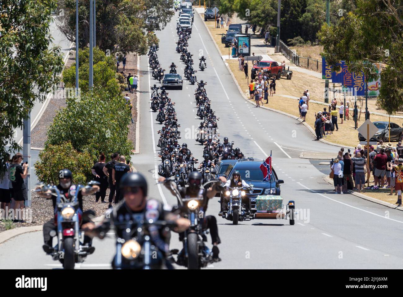 A motorcade follows the coffin of Rebels bikie Nick Martin into ...