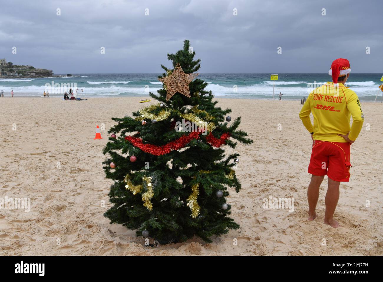 A Christmas tree is seen on a windy and rainy Bondi Beach in Sydney ...