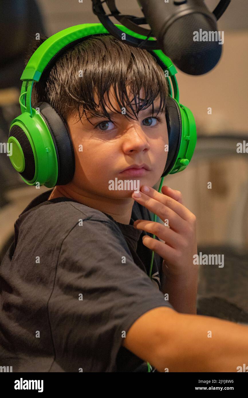 Child ready and equipped to start gaming and live streaming at home in ...