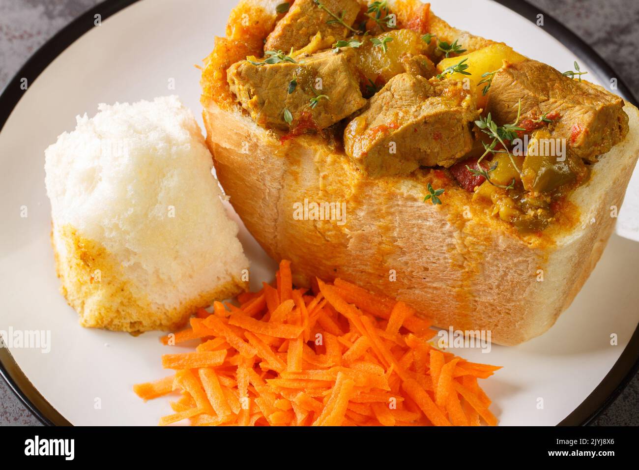 Closeup of lamb bunny chow the popular, Indian fast food cuisine which ...