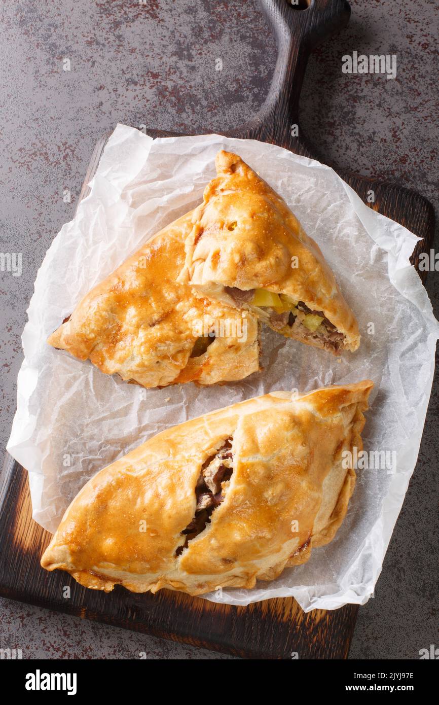 Traditional Cornish pasty filled with beef meat, potato and vegetables ...