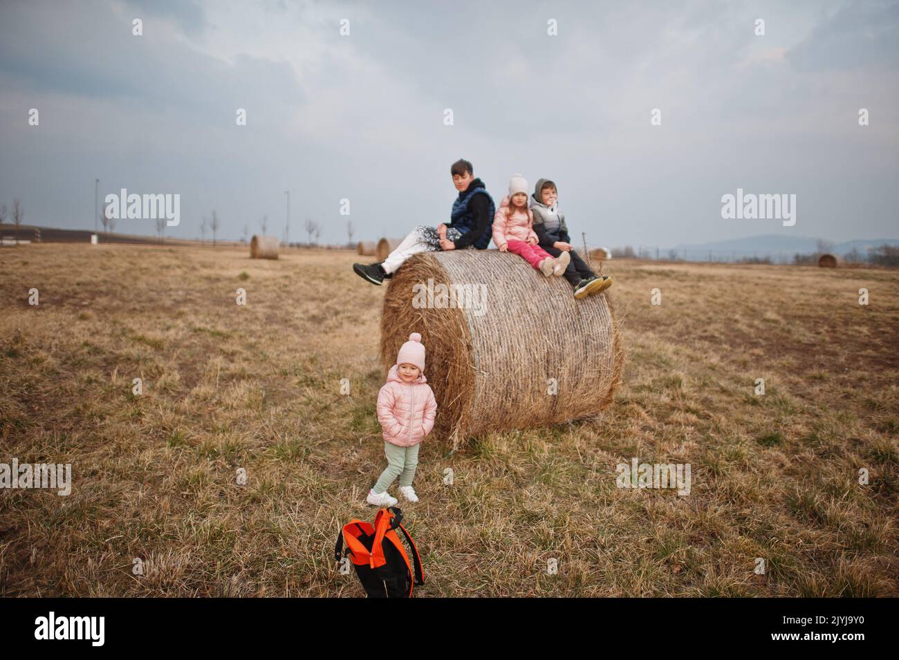 Children sitting on hay bales hi-res stock photography and images - Alamy