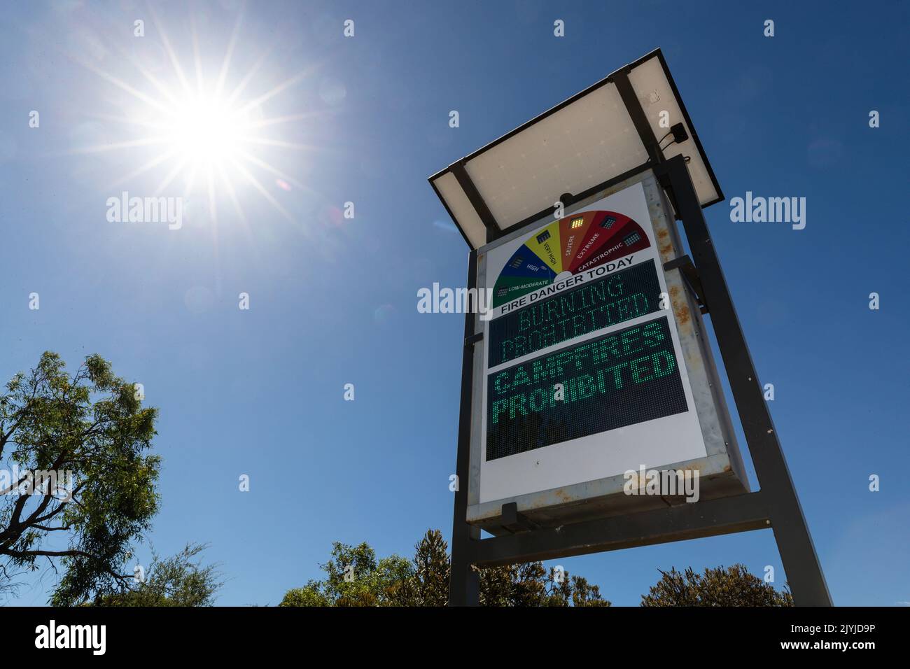 A roadside fire danger sign indicating severe conditions with camp ...