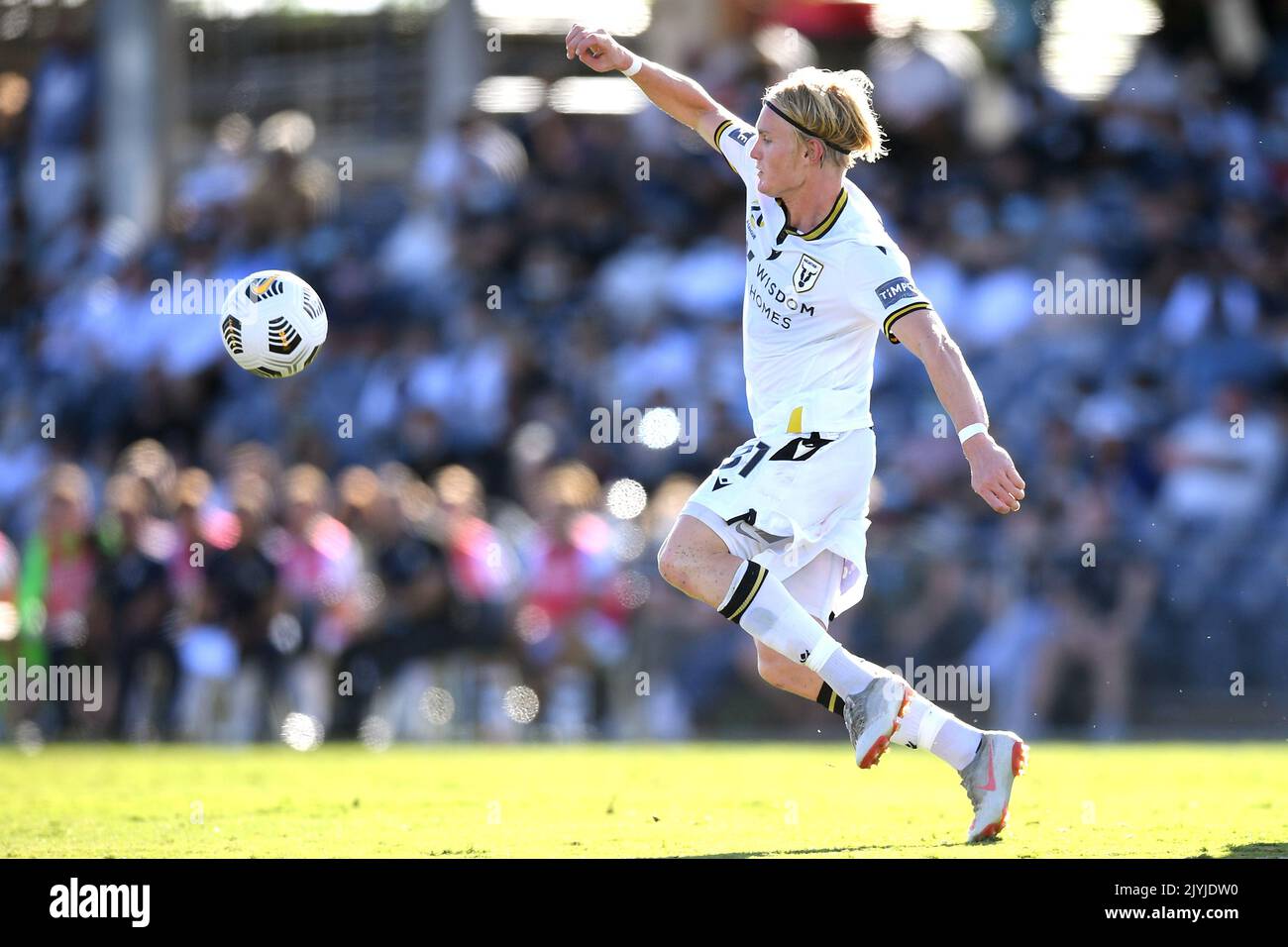 Lachlan Rose of the Bulls attempts to control the ball during the A ...