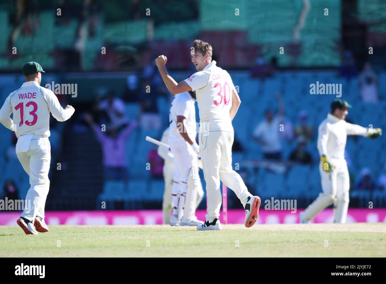 Pat Cummins of Australia celebrates taking the wicket of Rohit Sharma ...