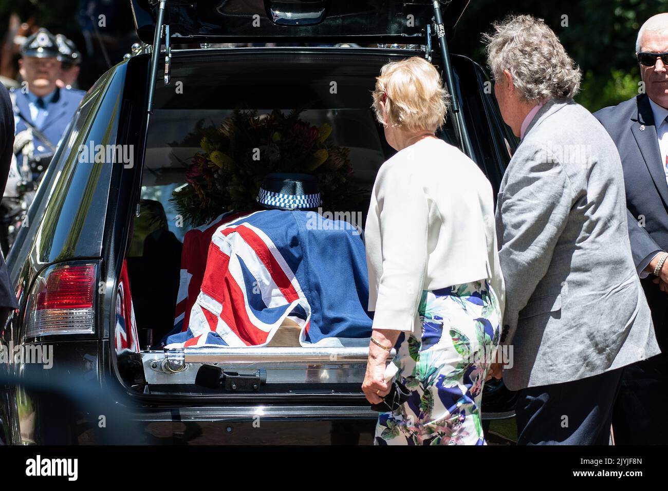 The parents of Senior Constable Kelly Foster are seen in front of her ...