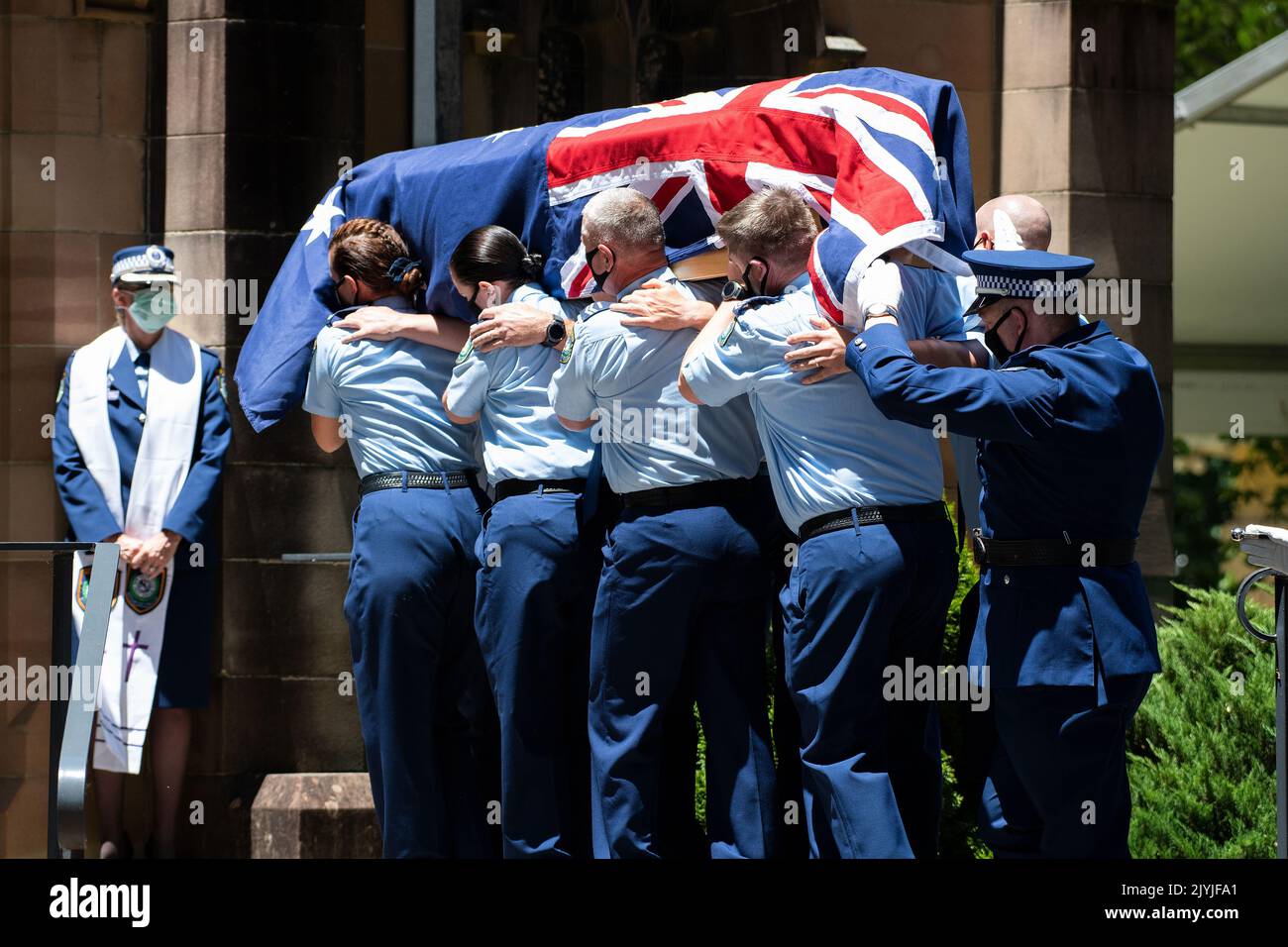 The casket of Senior Constable Kelly Foster is carried into the church ...