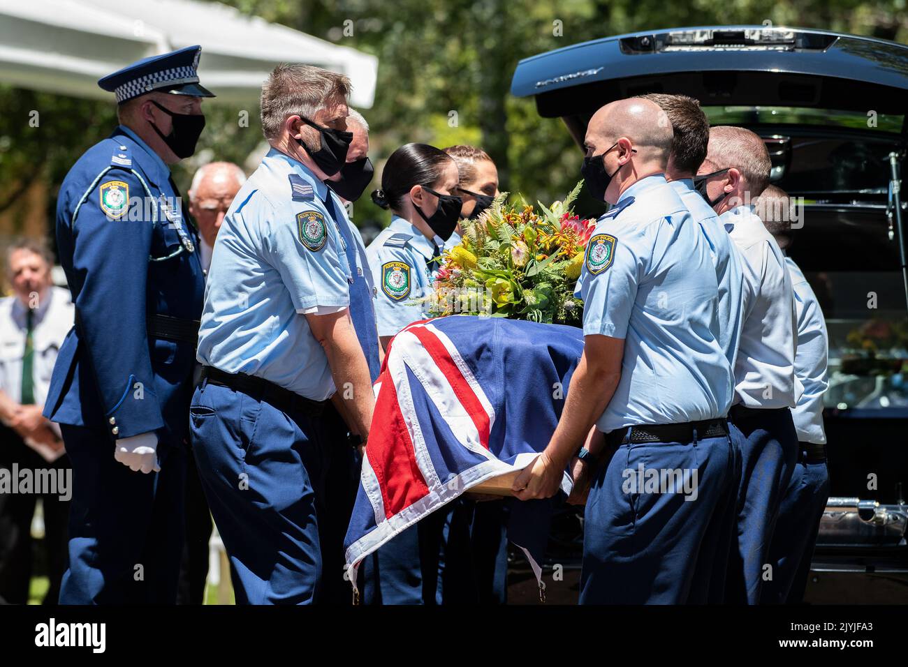 The casket of Senior Constable Kelly Foster is taken out of the hearse ...