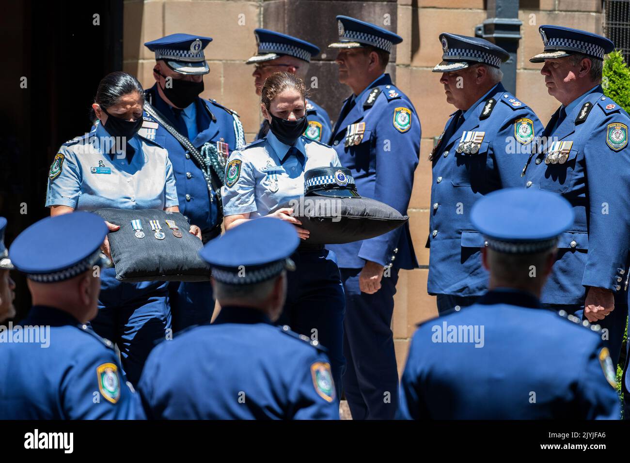 Senior Constable Kelly Foster’s police hat and medals are carried out ...