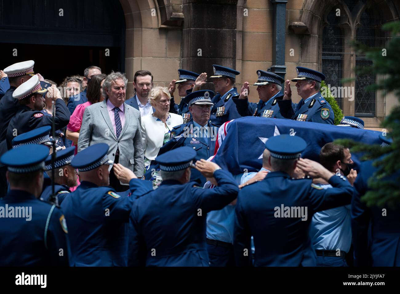 The parents of Senior Constable Kelly Foster are seen as her casket ...