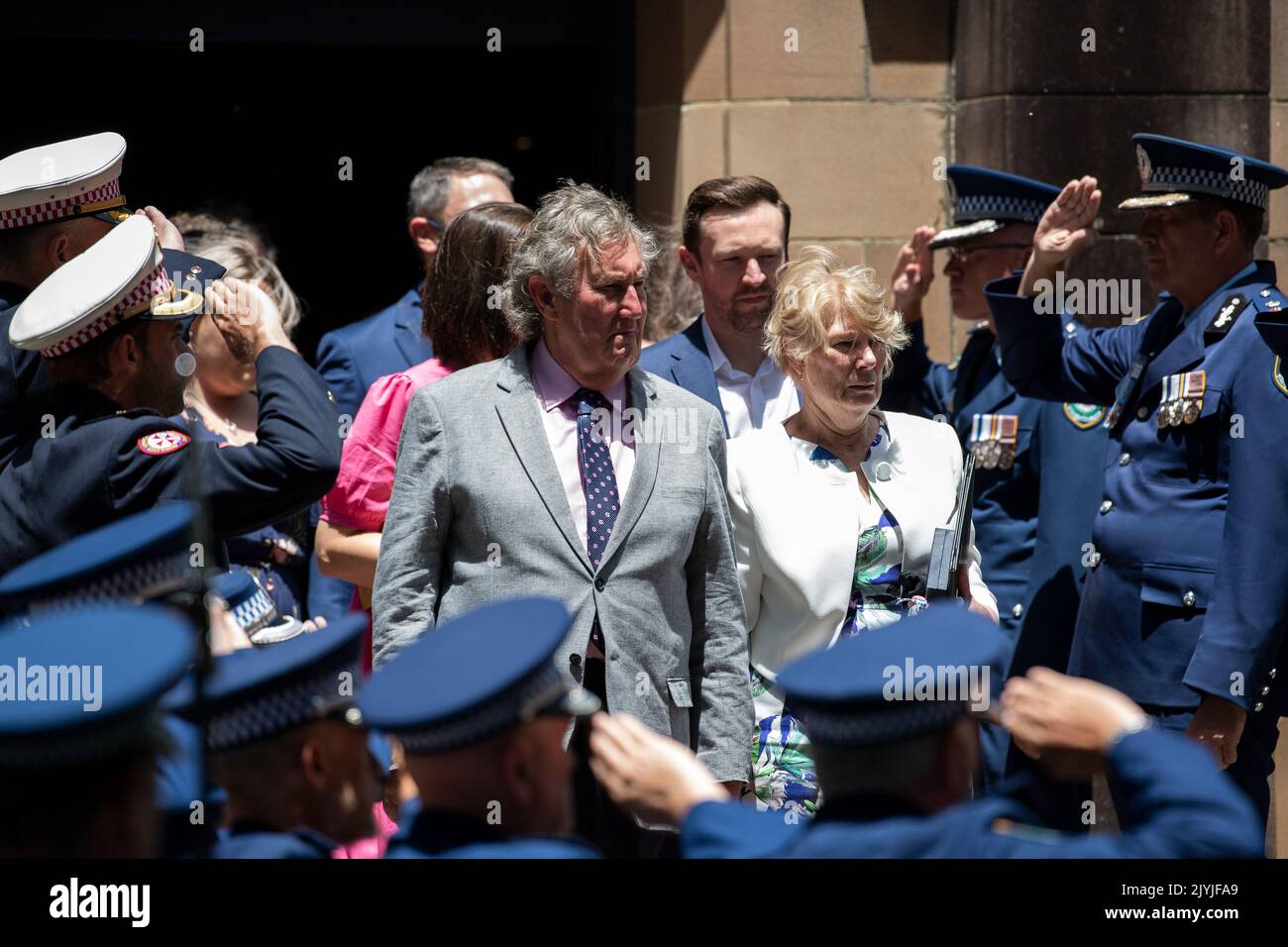 The parents of Senior Constable Kelly Foster are seen as her casket ...
