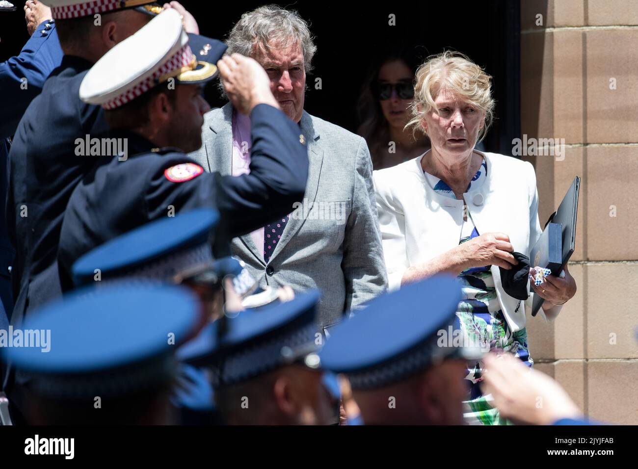The parents of Senior Constable Kelly Foster are seen as her casket ...