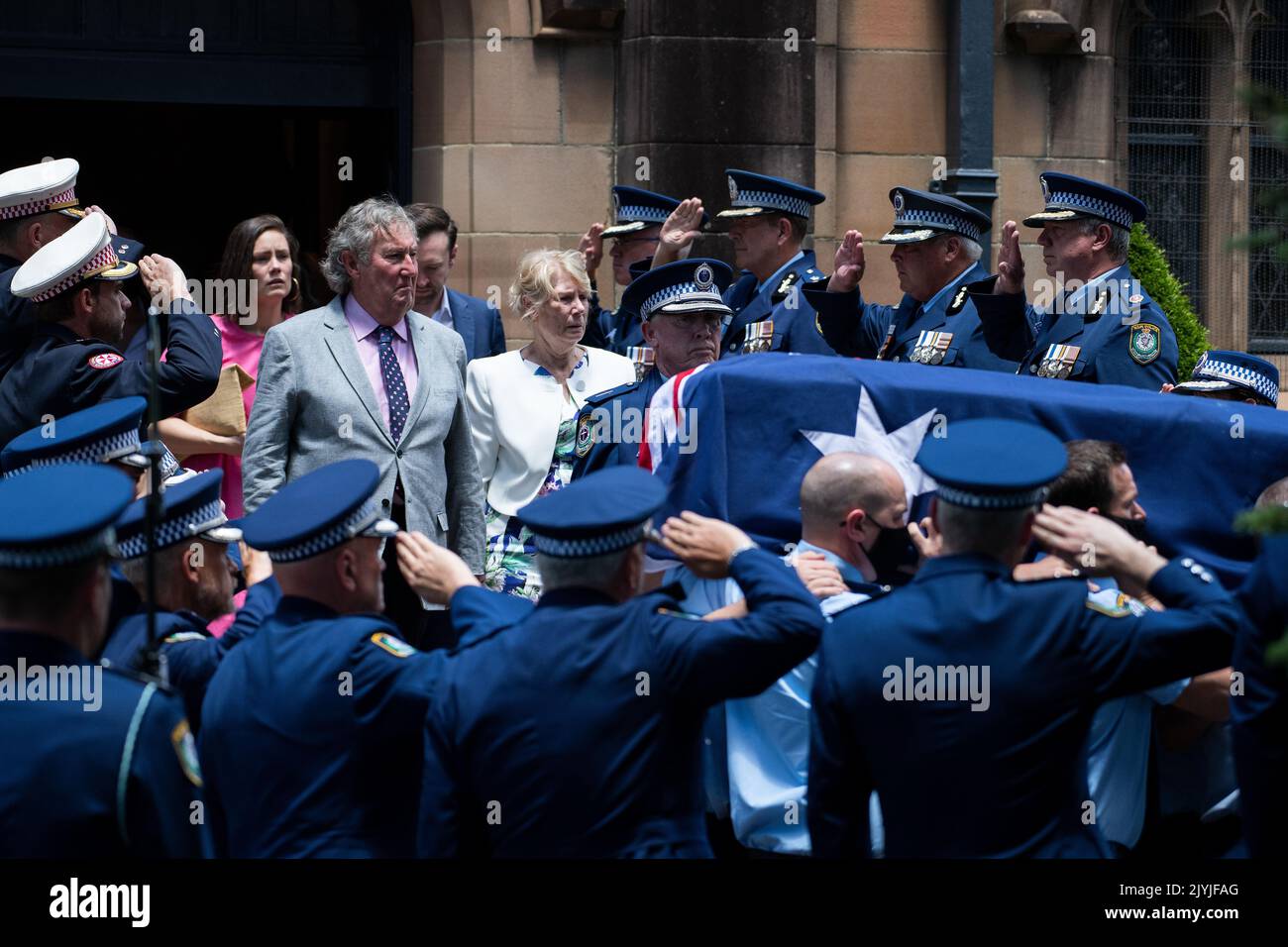 The parents of Senior Constable Kelly Foster are seen as her casket ...