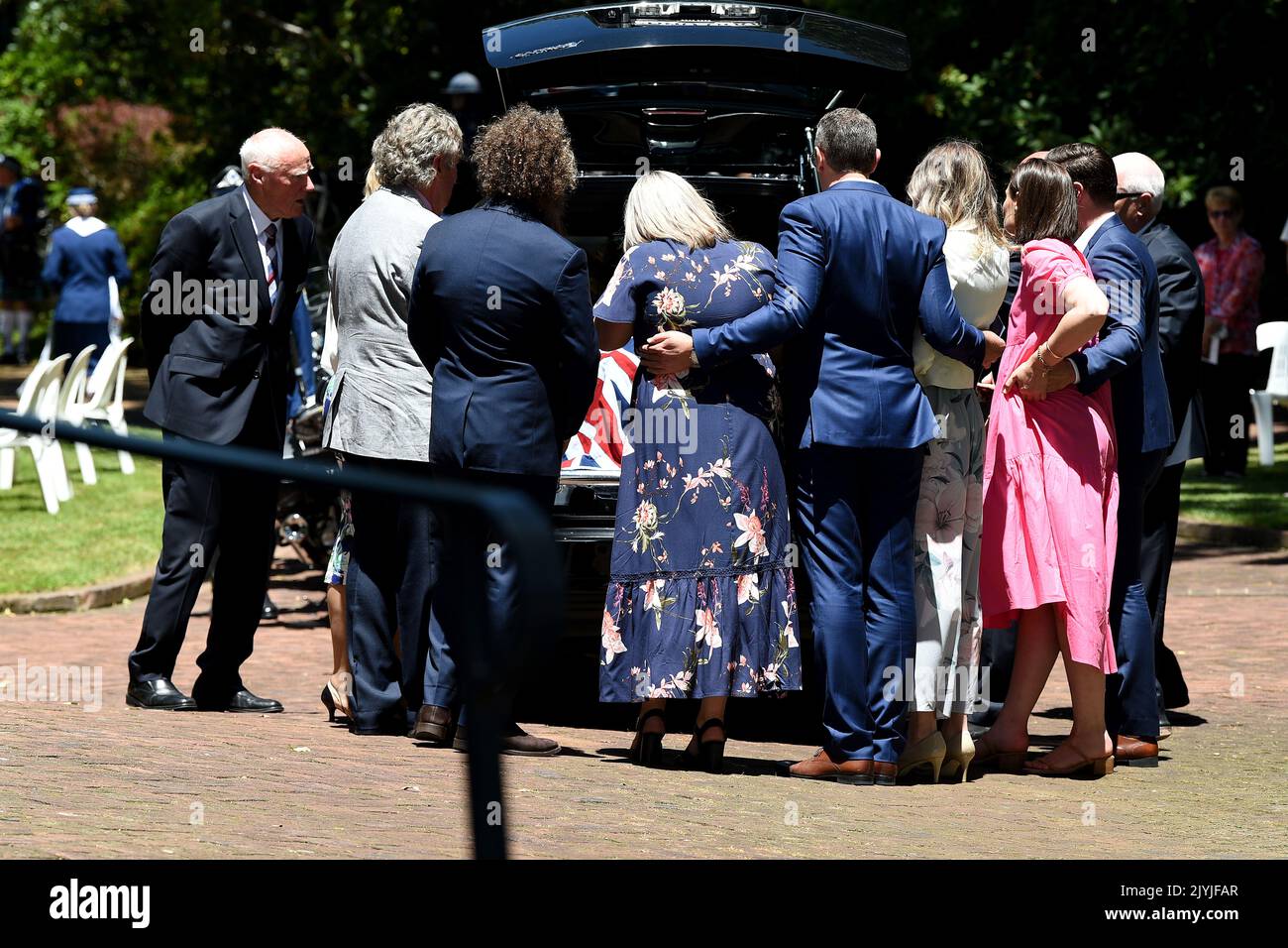 The family of Senior Constable Kelly Foster are seen in front of her ...