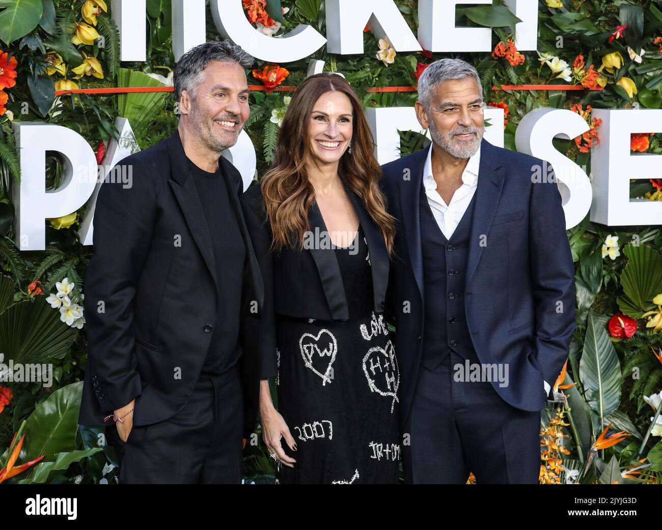 (L-R) Ol Parker, Julia Roberts, and George Clooney attend the world premiere of Ticket To ...