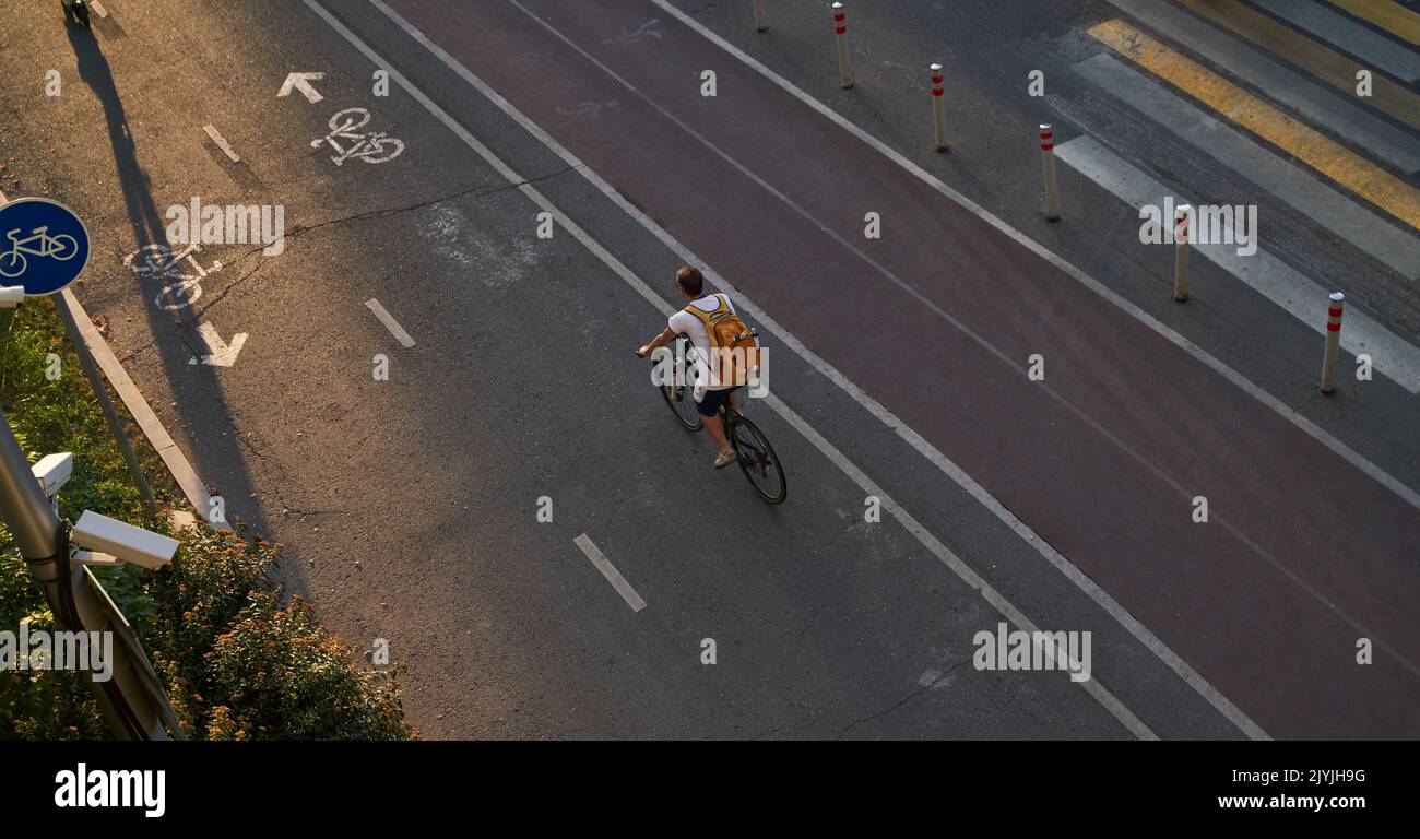 Man bicycling on cycling road. Concept of active lifestyle. Top aerial ...