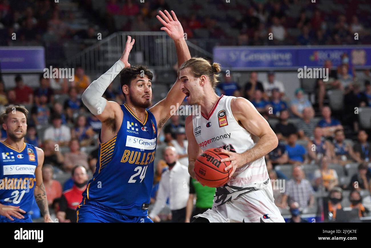 Sam Froling (right) of the Hawks takes on Tyrell Harrison (left) of the ...