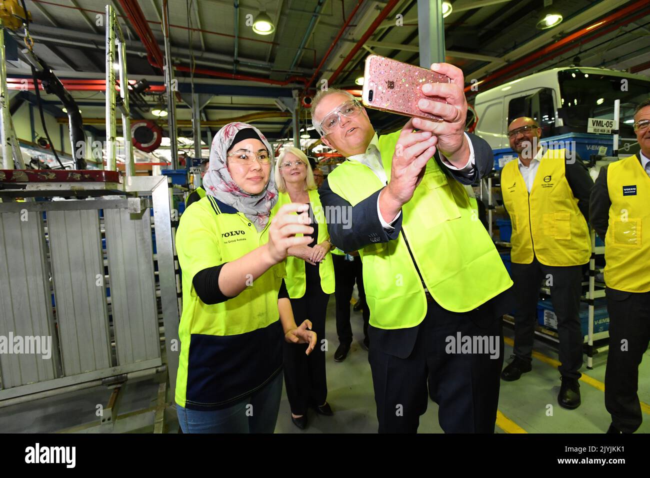Australian Prime Minister Scott Morrison (centre) poses for a selfie ...