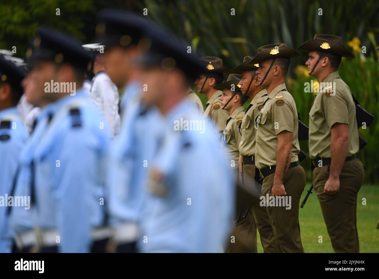 Military guard are seen during a flag raising ceremony on Australia Day ...