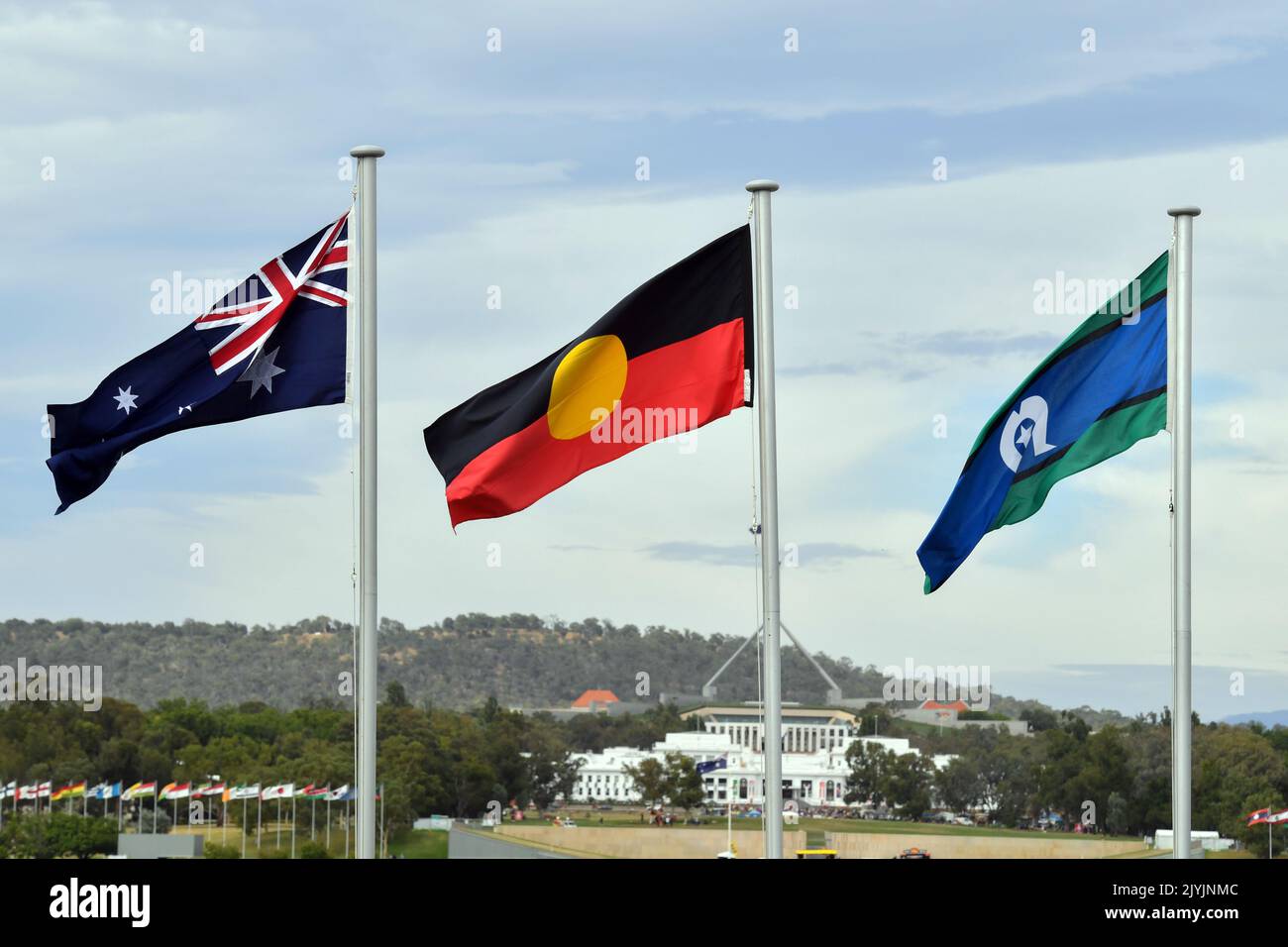 The Australian, Aboriginal and Torres Strait flags flutter during an ...