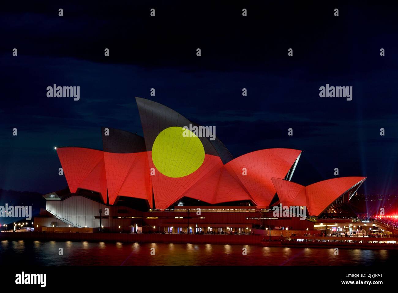 The Aboriginal flag is projected onto the sails of the Sydney Opera ...