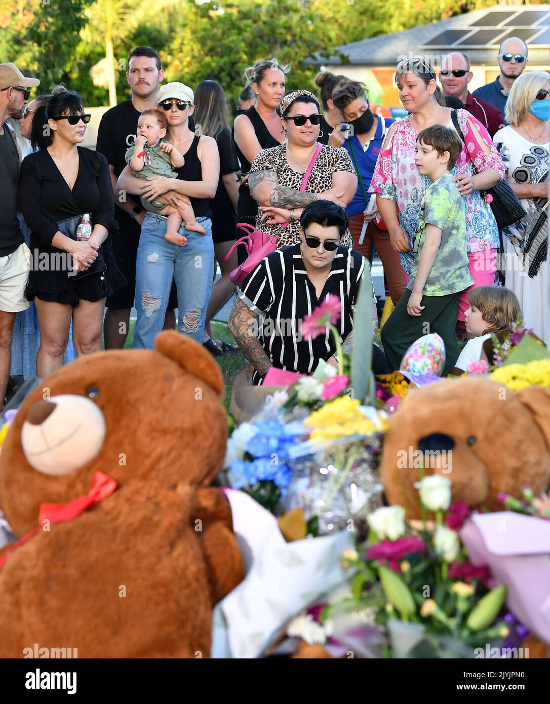 People are seen at a vigil for Kate Leadbetter, 31, and Matthew Field ...