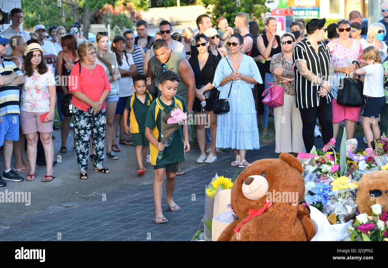 People are seen at a vigil for Kate Leadbetter, 31, and Matthew Field ...