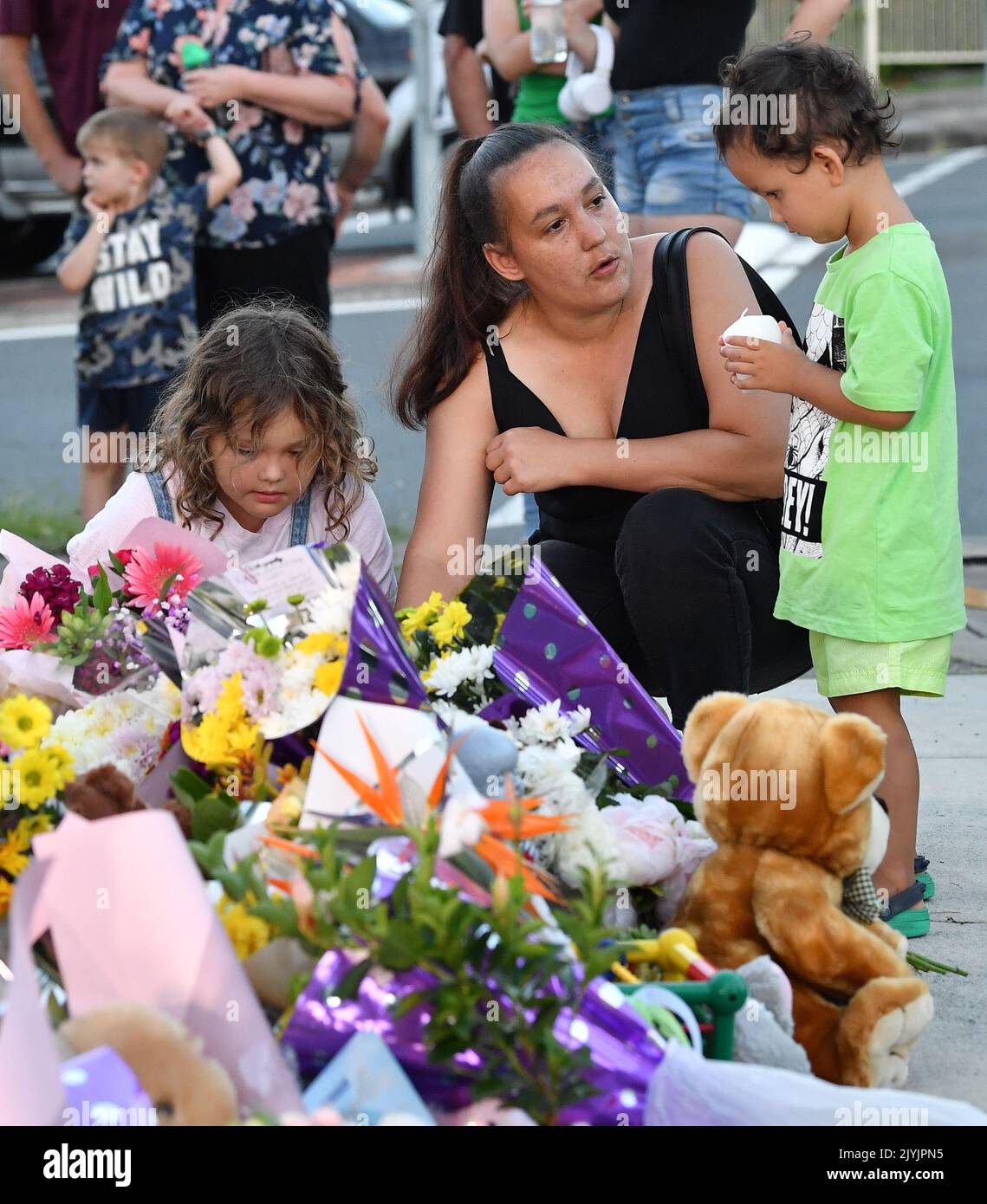 People are seen laying flowers at a vigil for Kate Leadbetter, 31, and ...