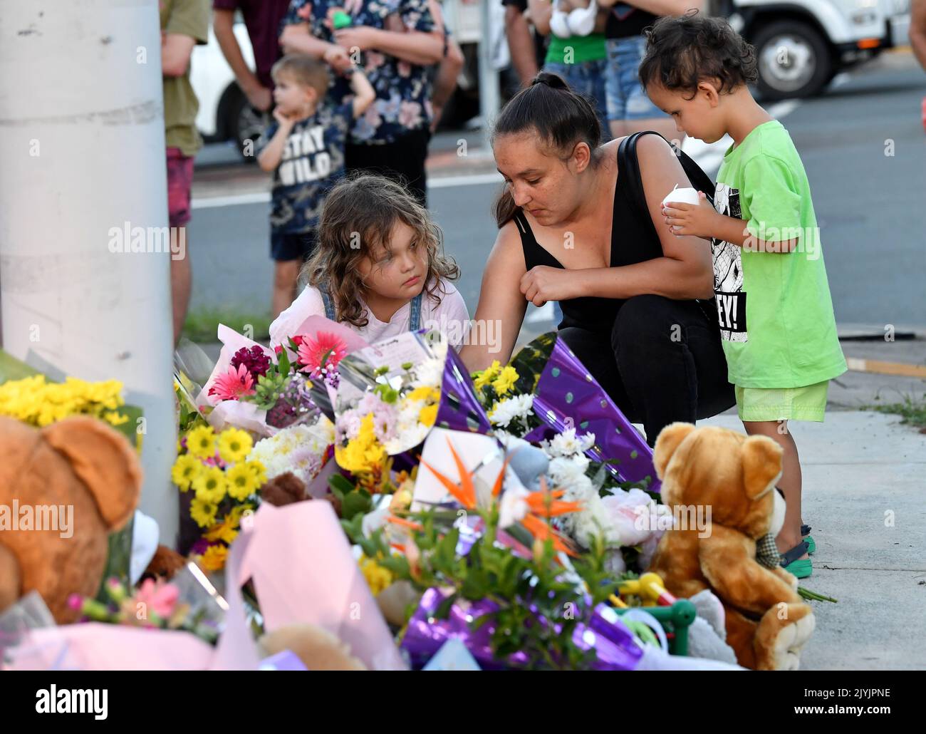People are seen laying flowers at a vigil for Kate Leadbetter, 31, and ...