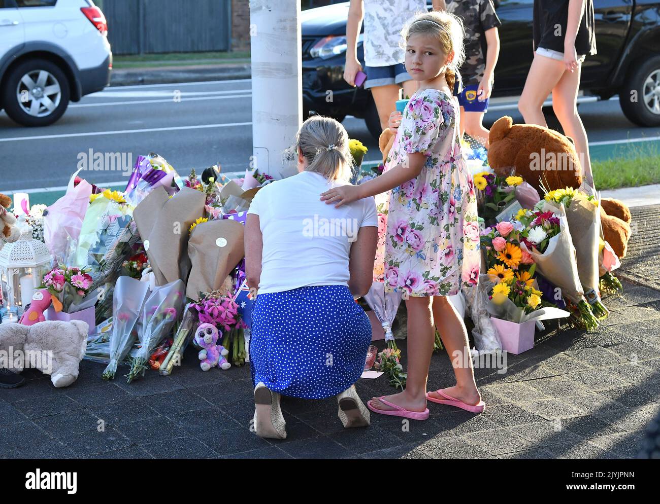 People are seen laying flowers at a vigil for Kate Leadbetter, 31, and ...