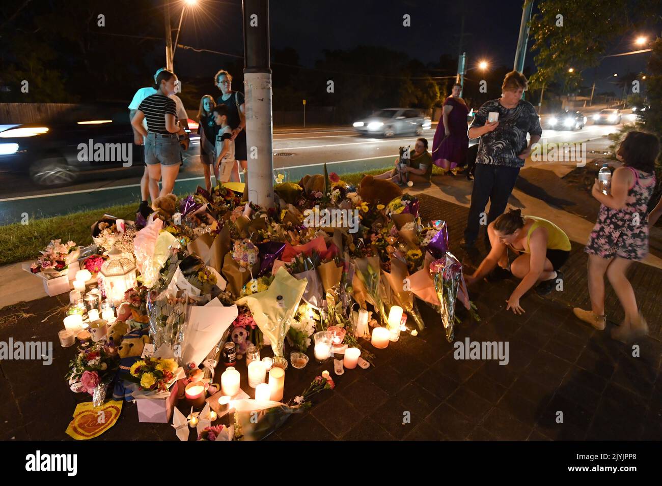 People are seen at a vigil for Kate Leadbetter, 31, and Matthew Field ...