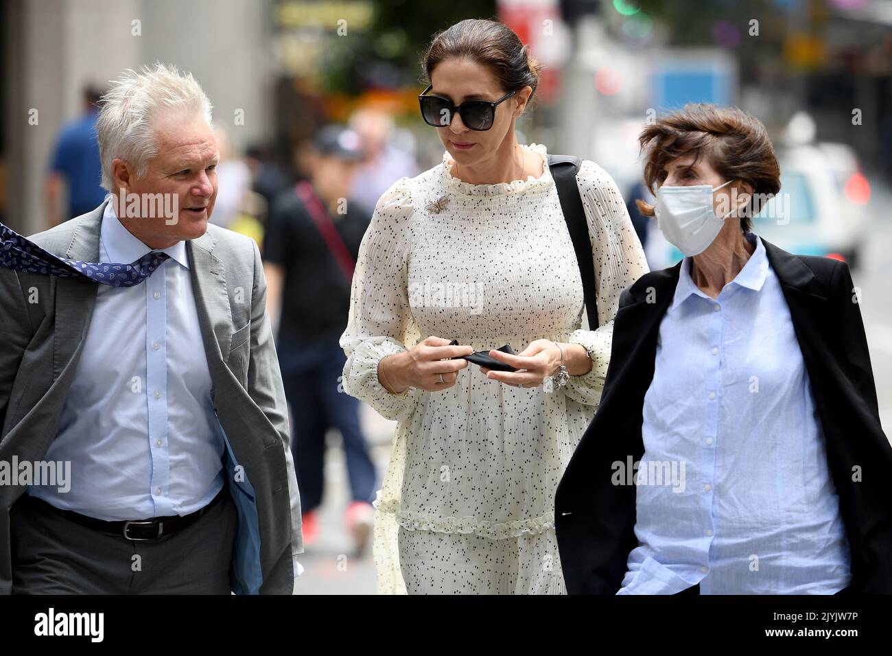 Neva Lozzi (centre) returns following a recess at the Downing Centre ...