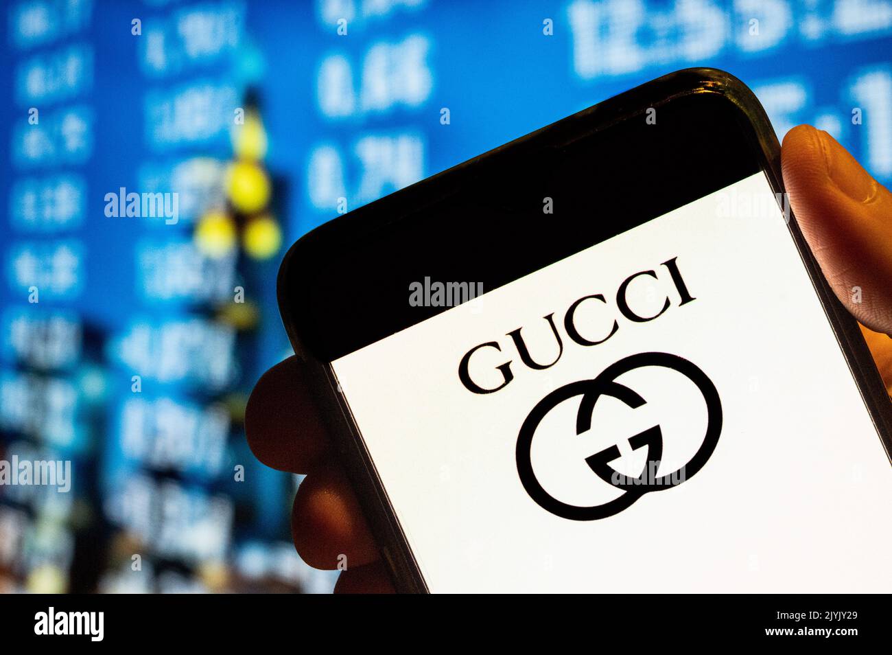 In this photo illustration, the Italian luxury fashion brand Gucci logo ...