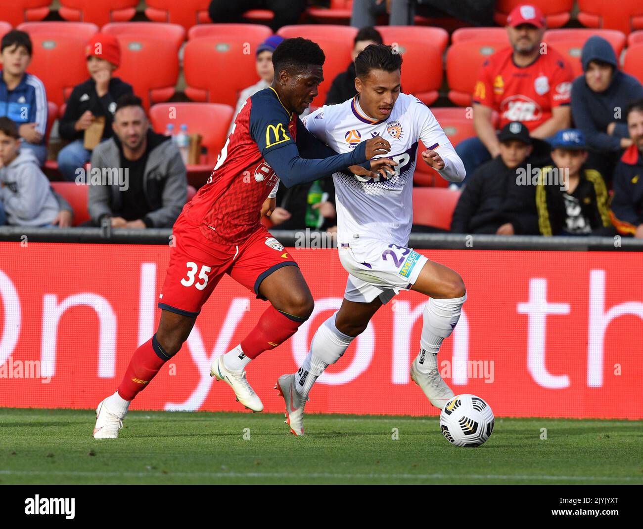 Al Hassan Toure of United and Dane Ingham of Perth Glory during the A ...