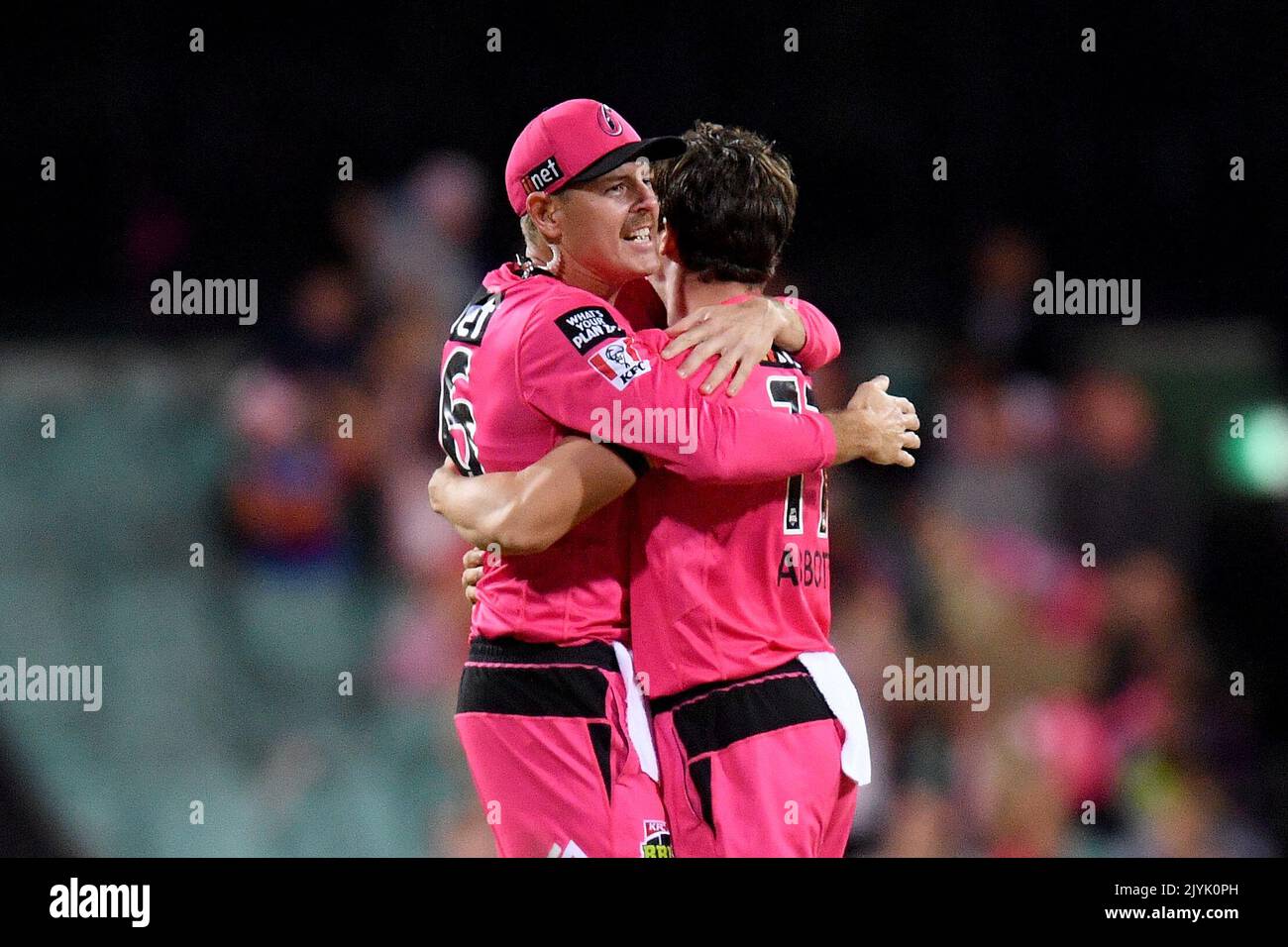 Sean Abbott of the Sixers (right) celebrates with Daniel Hughes after ...
