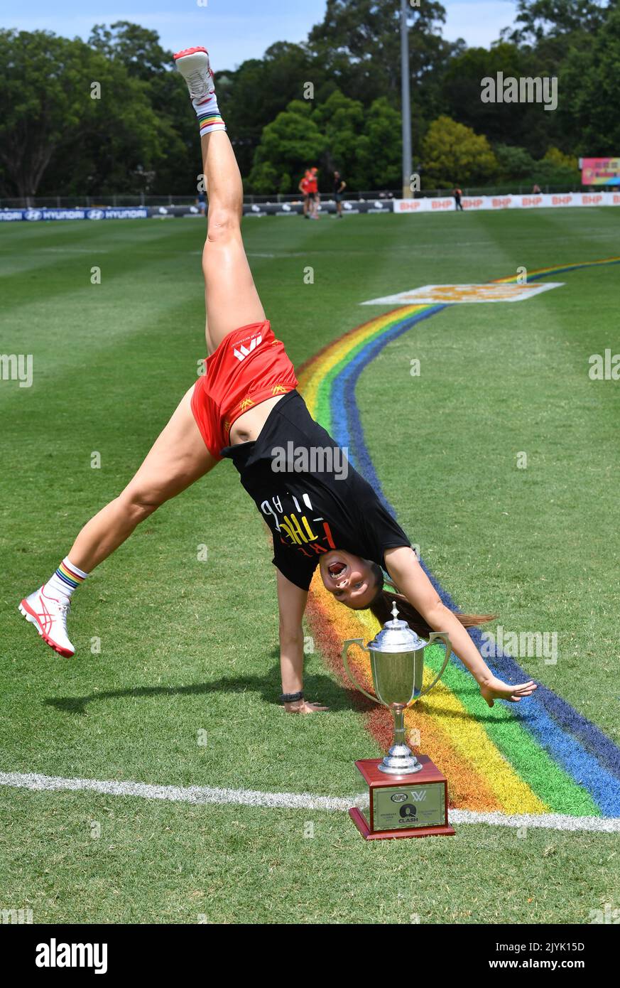 Jade Pregelj of the Suns is seen performing a cartwheel behind the ...