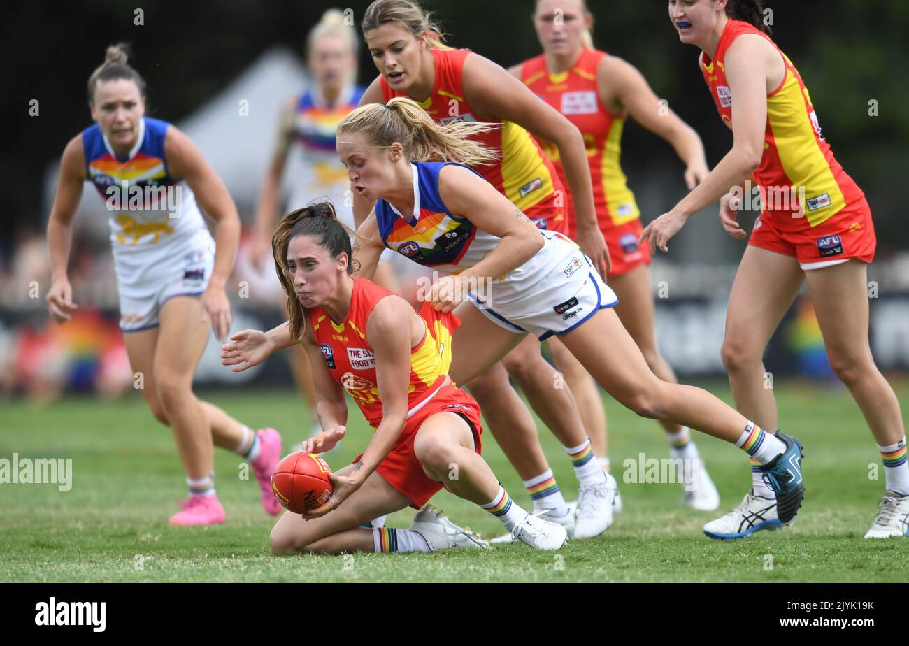 Cheyenne Hammond (centre) of the Suns is tackled by Isabel Dawes of the ...