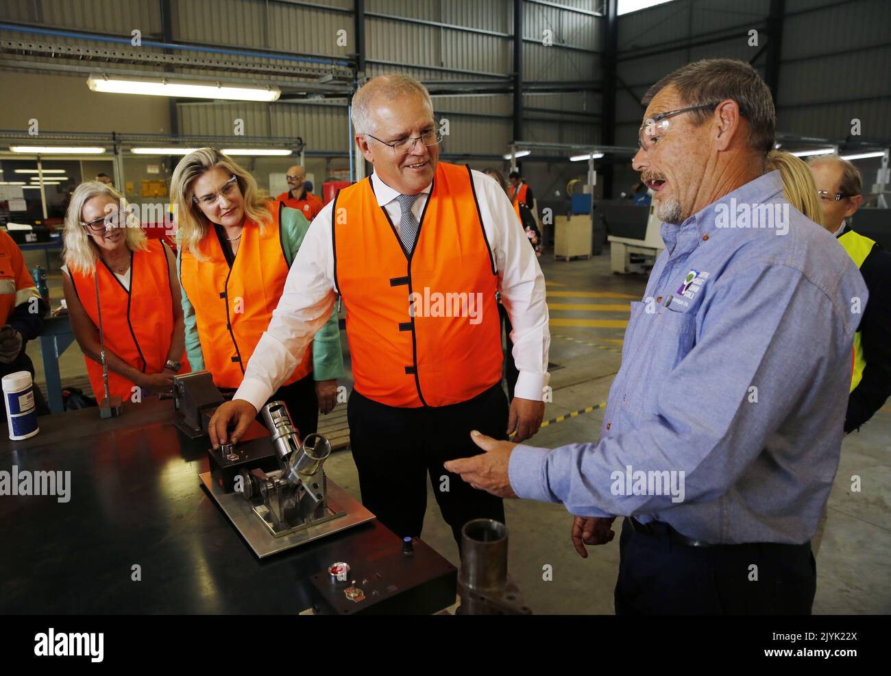 Australian Prime Minister Scott Morrison is shown a piston pump ...