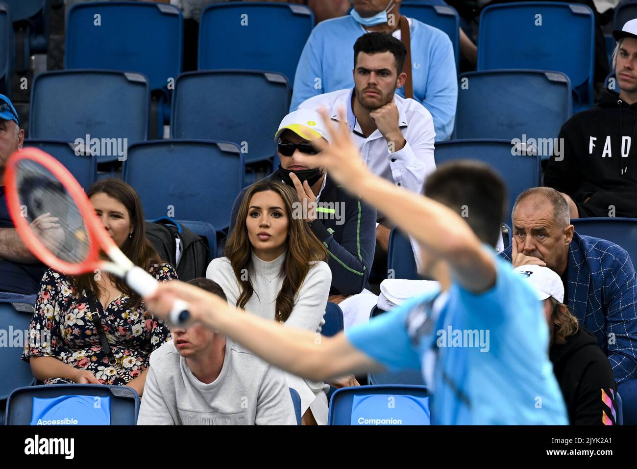 Girlfriend Vanessa Sierra (left) and father John Tomic (right) observe ...
