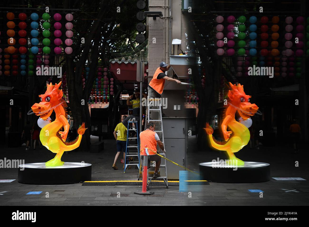 Tradesmen at work near a Dragon artwork at the offical media call for ...