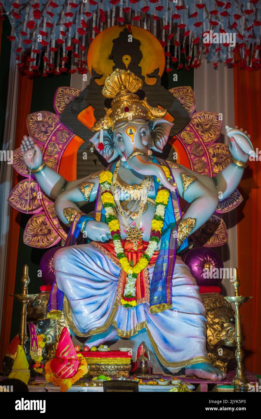 A beautiful idol of Lord Ganesha being worshipped at a mandal in Mumbai ...