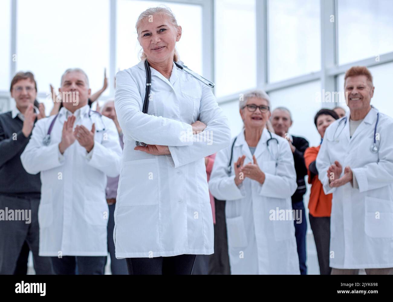 a group of doctors and recovered patients celebrate the victory Stock ...