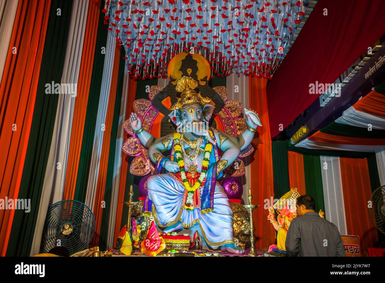 A beautiful idol of Lord Ganesha being worshipped at a mandal in Mumbai ...