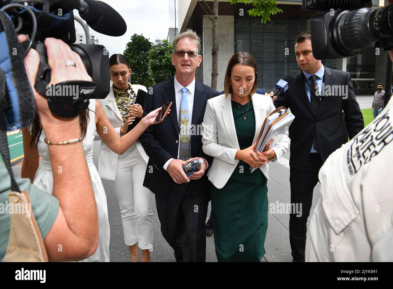 Keith Benjamin Greenland (centre) is seen leaving the Brisbane District ...