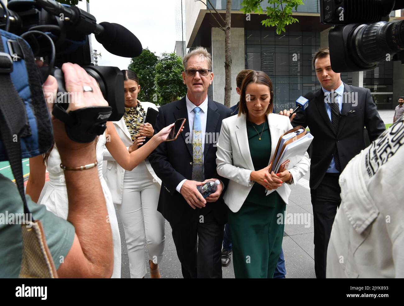 Keith Benjamin Greenland (centre) is seen leaving the Brisbane District ...