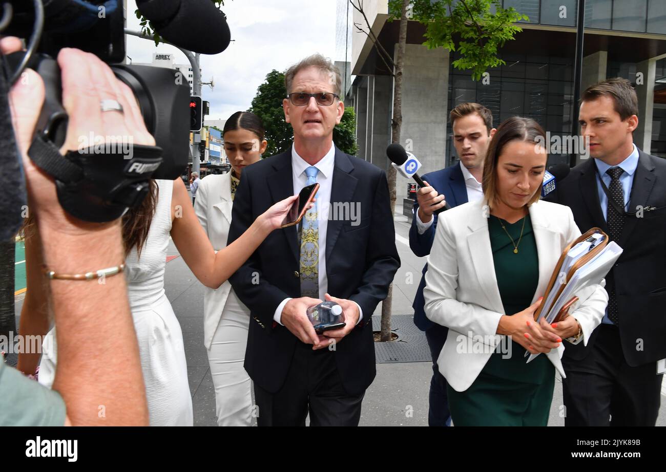Keith Benjamin Greenland (centre) is seen leaving the Brisbane District ...