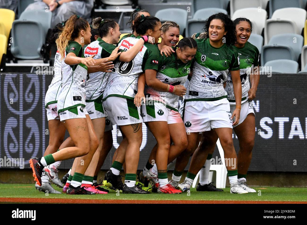 Zahara Temara (centre) of the Maori All Stars celebrates scoring a try ...